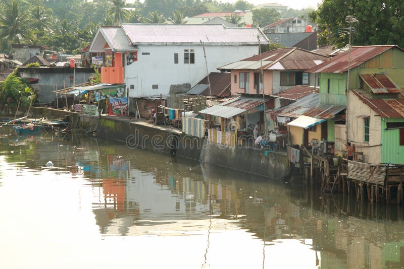 Poor houses by the sea editorial stock photo. Image of manado - 27617008