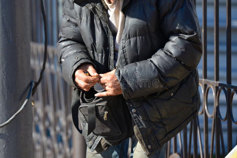 A Poor and Impoverished Person Asks for Alms Stock Photo - Image of ...