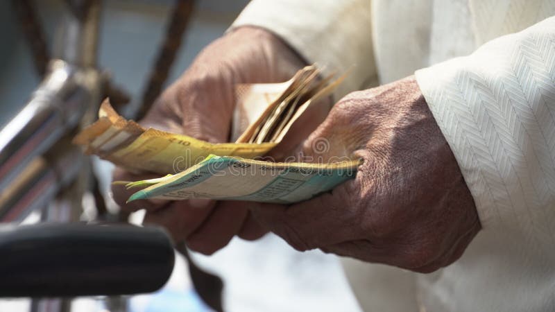 A Poor Man Counting and Having Some Indian Rupees in Hand Close Up ...
