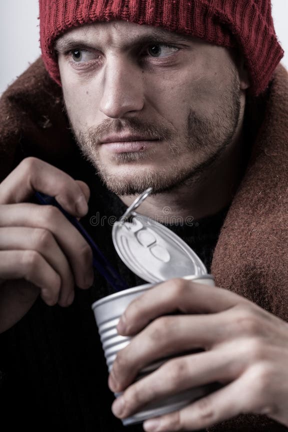 Poor man eating preserve stock photo. Image of miserable - 40995404