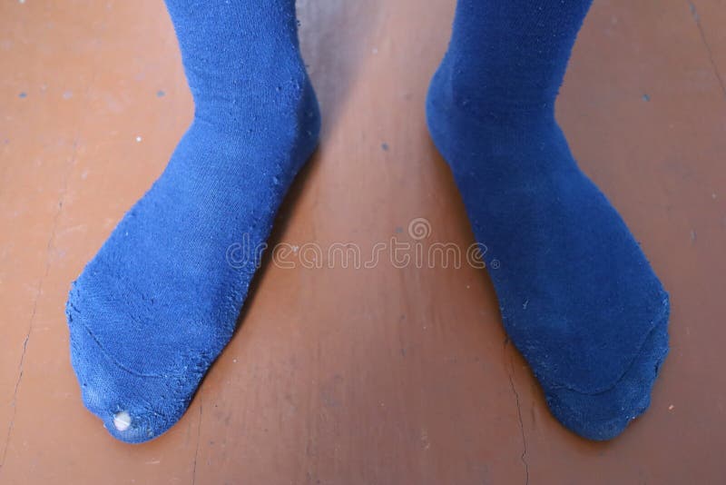 The poor man in torn socks stock image. Image of shabby - 253881629