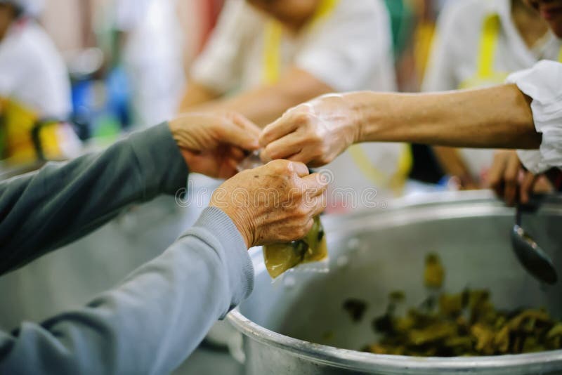 Poor People Bring Containers To Contain Food from the Sharing of the ...