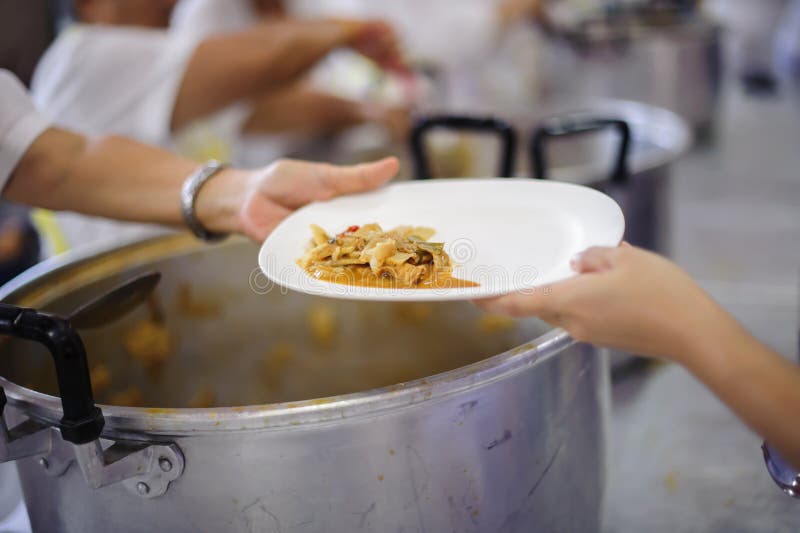 Poor People Bring Containers To Contain Food from the Sharing of the ...