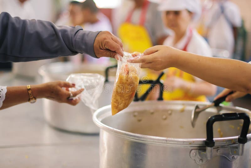 Poor People Bring Containers To Contain Food from the Sharing of the ...