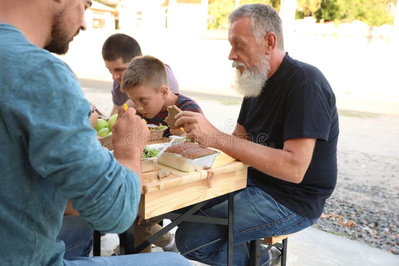 Poor People Eating Food at Wooden Table Stock Photo - Image of centre ...