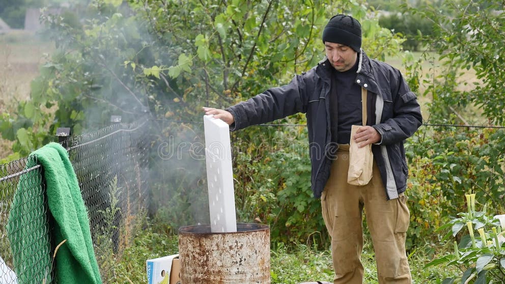 Poor People Warming Near Fire Trash Barrel and Drink Vodka Stock Photo ...