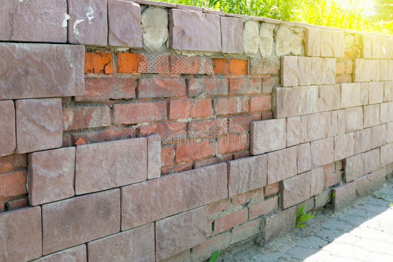 Broken Facade of the Building, Marriage in the Work of Builders. Stock ...