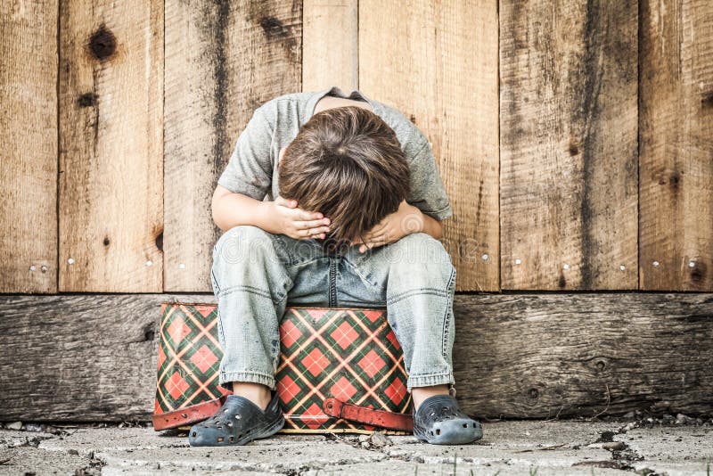 Sad Homeless Boy stock photo. Image of small, earth - 145573556