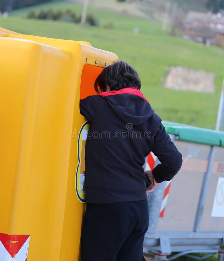 Poor Young Boy Looks into the Garbage Can Stock Image - Image of ...