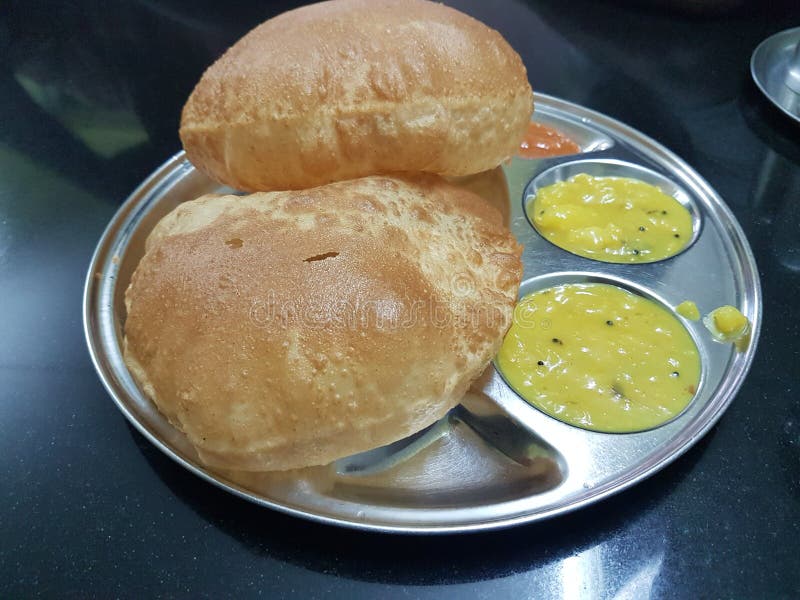 Deep Fried Poori or Puri Served with Spicy Potato Onion Curry and ...