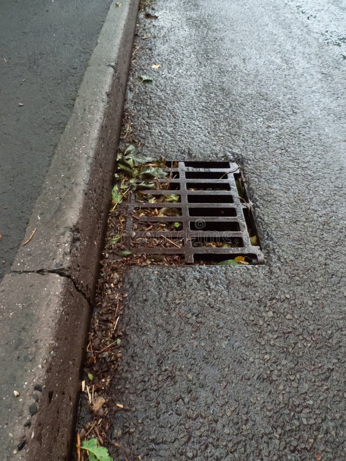 Poorly Maintained Blocked Roadside Drain Causing Flooding Risk Stock ...