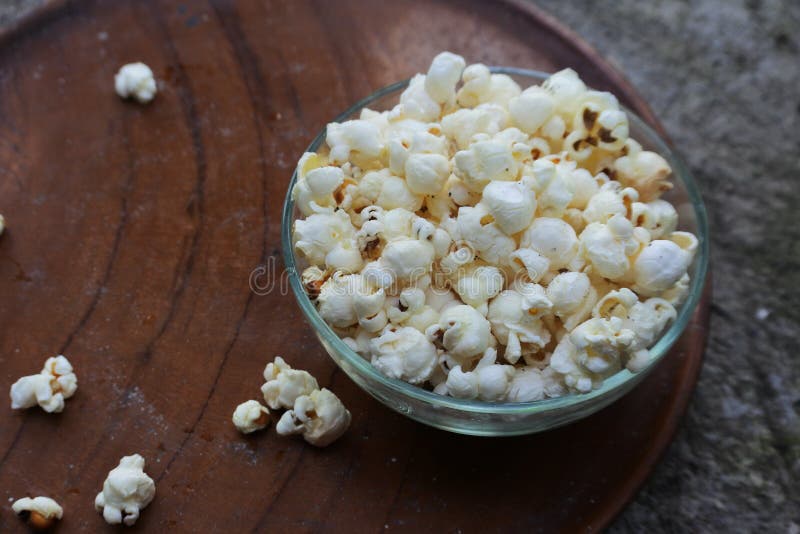 Pop Corn on Wooden Bottomed Glass Container. the Process of Making ...