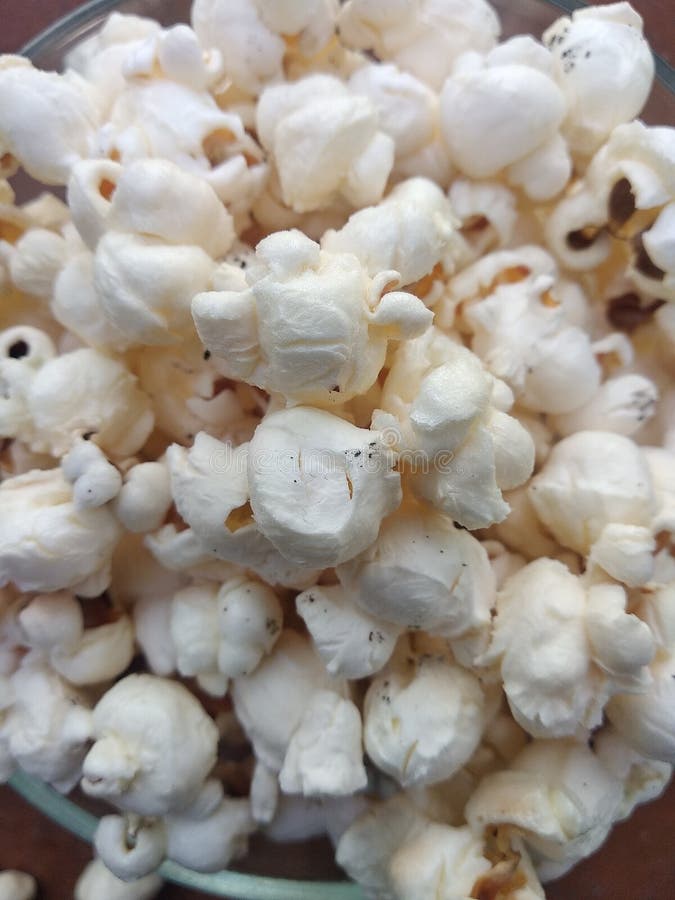 Pop Corn on a Wooden Bottomed Glass Container. White Popcorn Stock ...