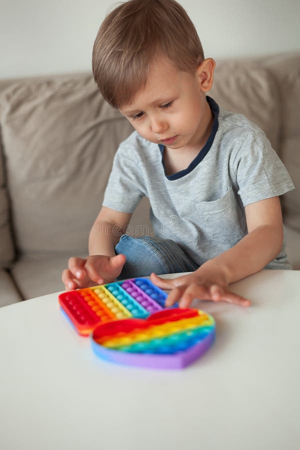 Pop it Toy Fidget, Child Play with Antistress Toy Stock Photo - Image ...