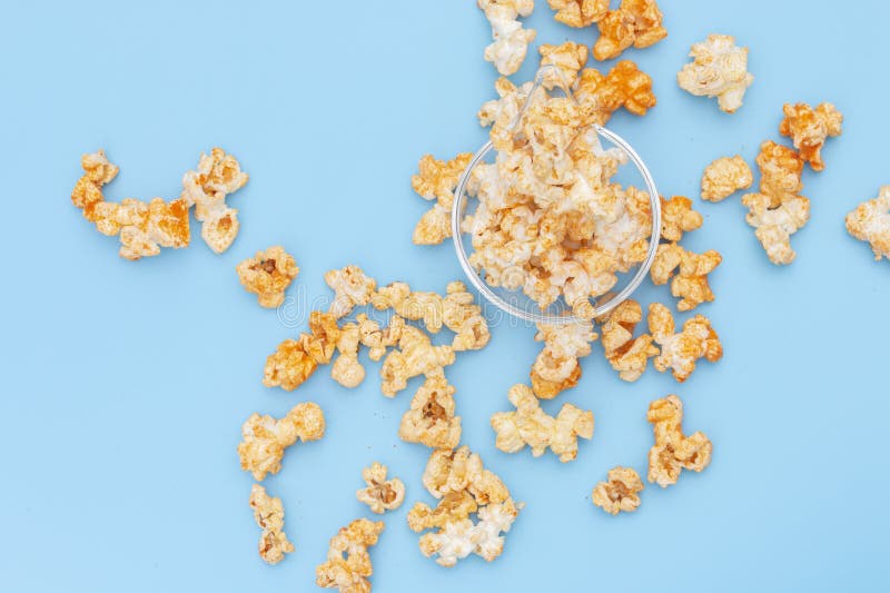 Popcorn in a Bowl on Blue Background Stock Image - Image of ...