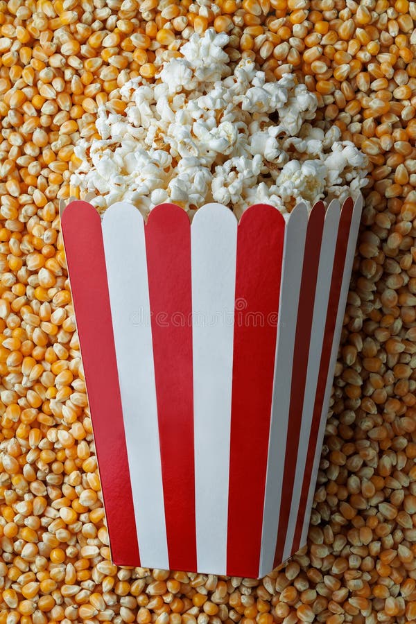 Popcorn in Carton Box on Corn Grain Background Stock Image - Image of ...
