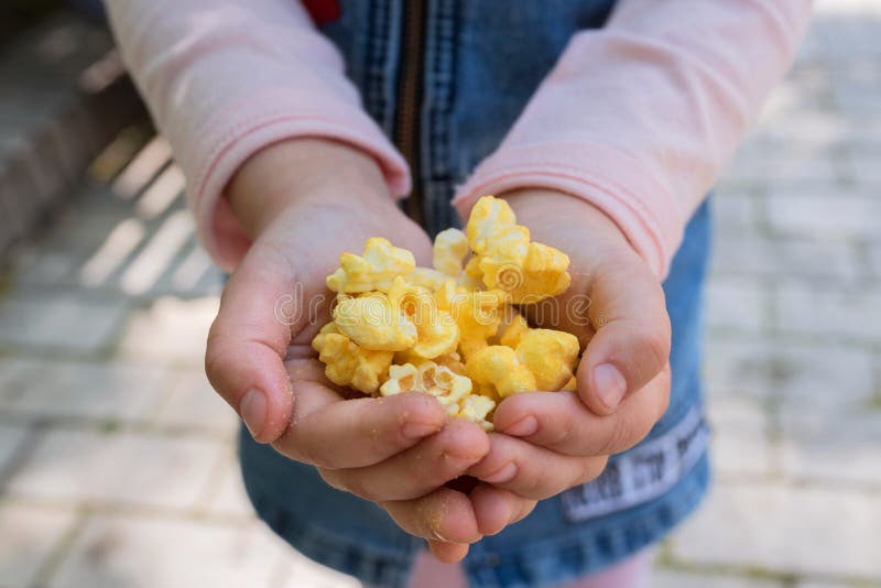 Popcorn in Childrens Hands Close Up Stock Image - Image of fluffy ...