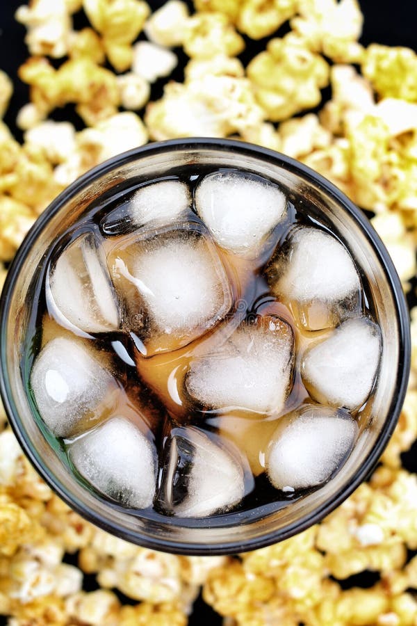 Popcorn and cola stock image. Image of kernel, liquid - 34561875