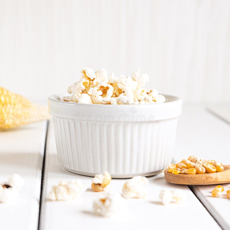 Popcorn, Corn Cob and Corn Grains on White Tabletop Stock Photo - Image ...