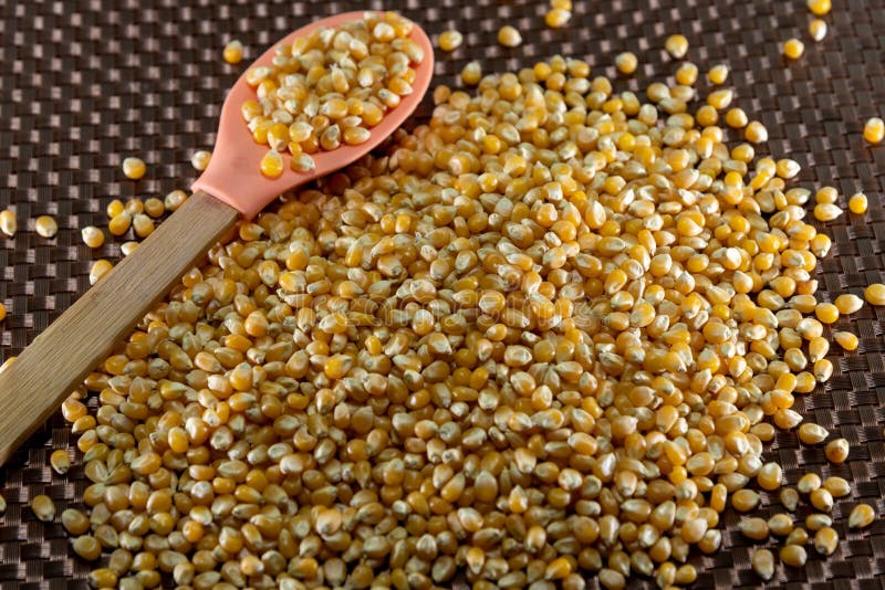 Popcorn Corn Grains on a Kitchen Table and Household Items Stock Image ...