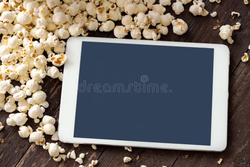 Popcorn with Digital Touch Screen Tablet Stock Image - Image of cinema ...