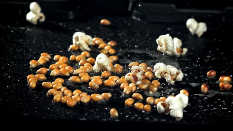 Popcorn Explodes in a Pan with a Splash of Oil. Filmed on a High-speed ...