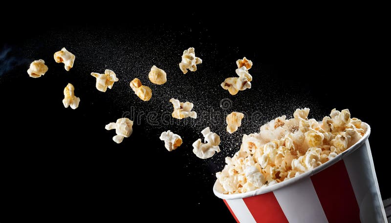 Popcorn Flying Up in the Air from Paper Bucket. Isolated on Black ...