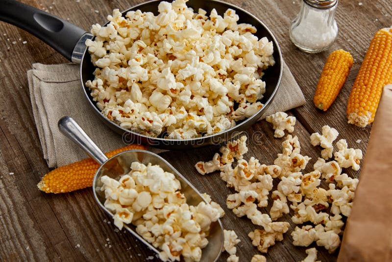 Popcorn in Frying Pan and on Stock Photo - Image of hardwood, crispy ...