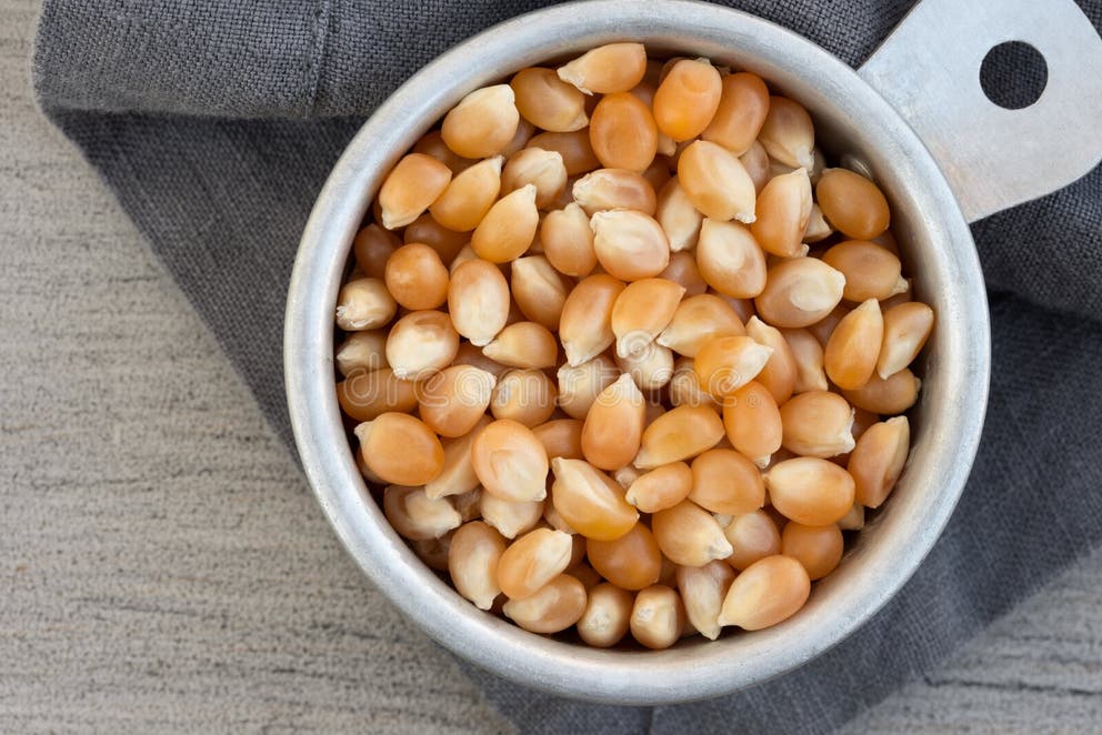 Popcorn Kernels in a Measuring Cup Stock Photo - Image of measuring ...