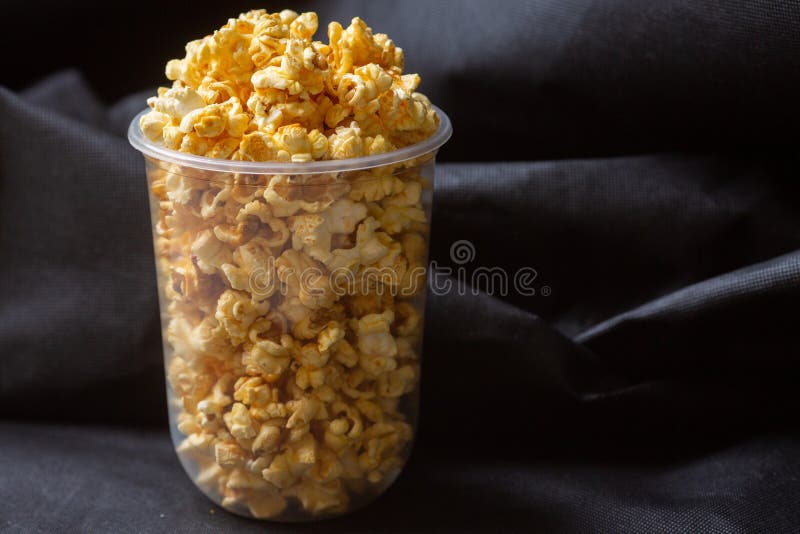 Popcorn in a large bucket stock photo. Image of isolated - 178207206