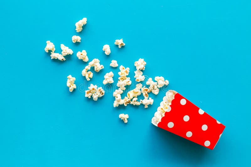 Popcorn in Paper Cup on Blue Desk Top View Stock Photo - Image of ...