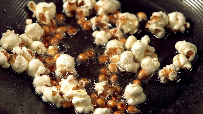 Popcorn Popping in Microwave Oven, from Kernels To Popped Corn Stock ...