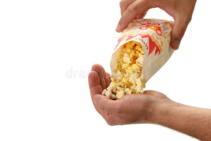 Popcorn Poured into a Hand stock photo. Image of treat - 25377222
