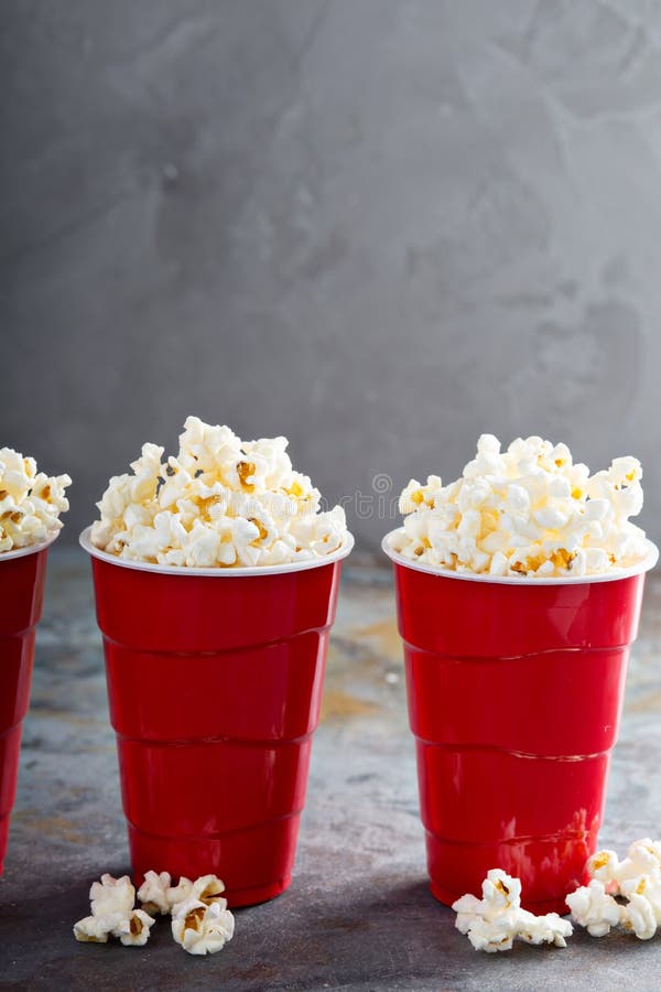 Popcorn in striped cups stock image. Image of colorful - 123927559