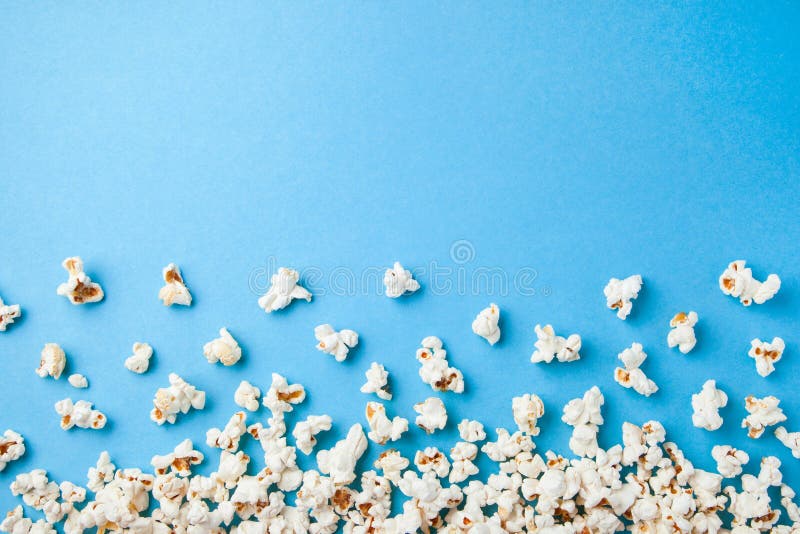 Popcorn Scattered on Blue Background. Copy Space for Text Stock Image ...