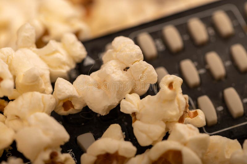 Popcorn Scattered on the Table and a Remote Control from the TV. Self ...