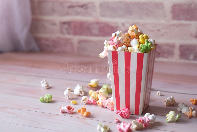 Popcorn Spilling Out of a Red and White Striped Paper Cup Stock Photo ...