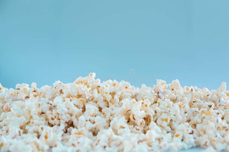 Popcorn Texture on a Blue Background Stock Photo - Image of closeup ...