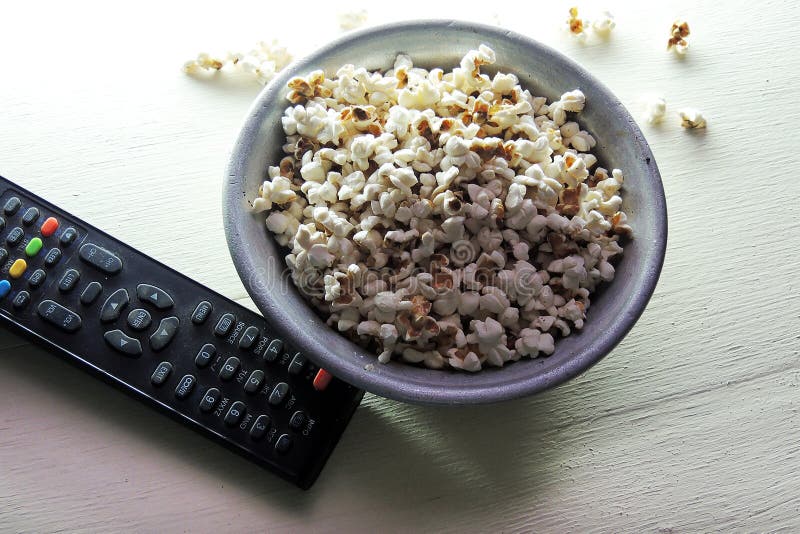 Popcorn and the TV remote stock photo. Image of popcorn - 80015236