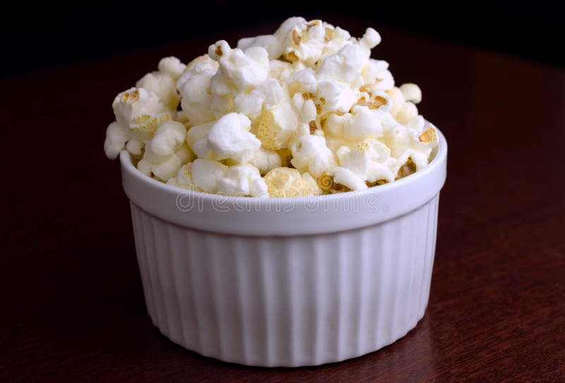 Popcorn in a White Ceramic Bowl Over Wood Background Stock Photo ...
