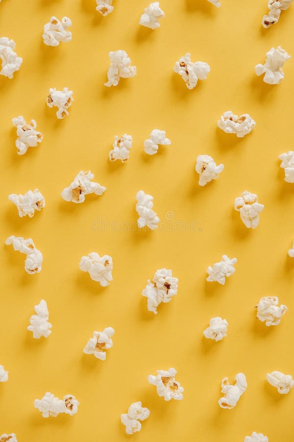 Popcorn on a Yellow Background As a Background Image. Top View Stock ...