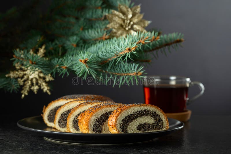 Poppy Seed Roll Pieces on a Background of Christmas Tree Stock Photo ...