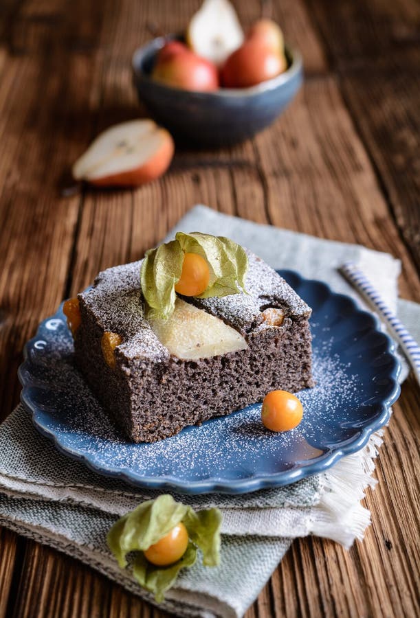 Poppy Seed Sponge Cake with Physalis and Pear Stock Photo - Image of ...