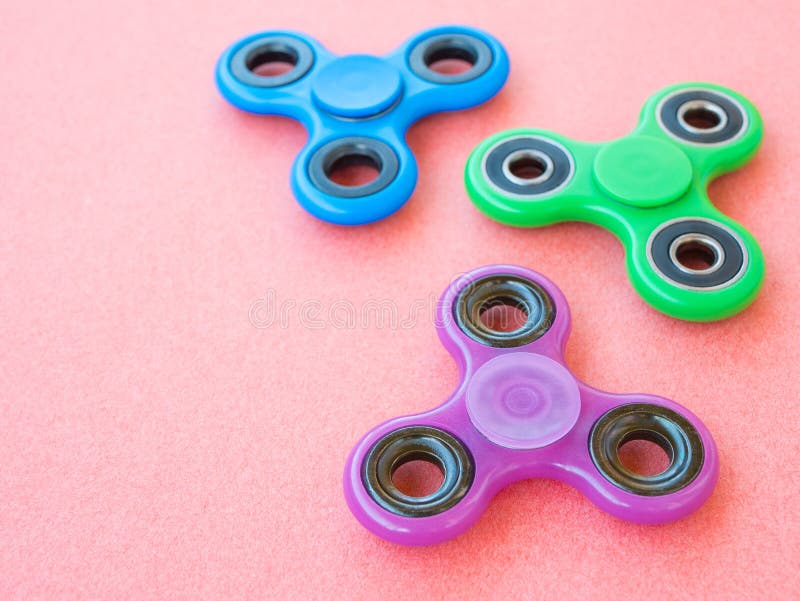 Popular Colourful Fidget Spinner Toy in a Gift Box on a Colored ...