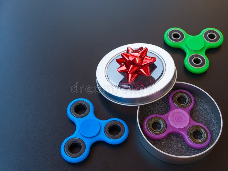 Popular Colourful Fidget Spinner Toy in a Gift Box on a Black ...