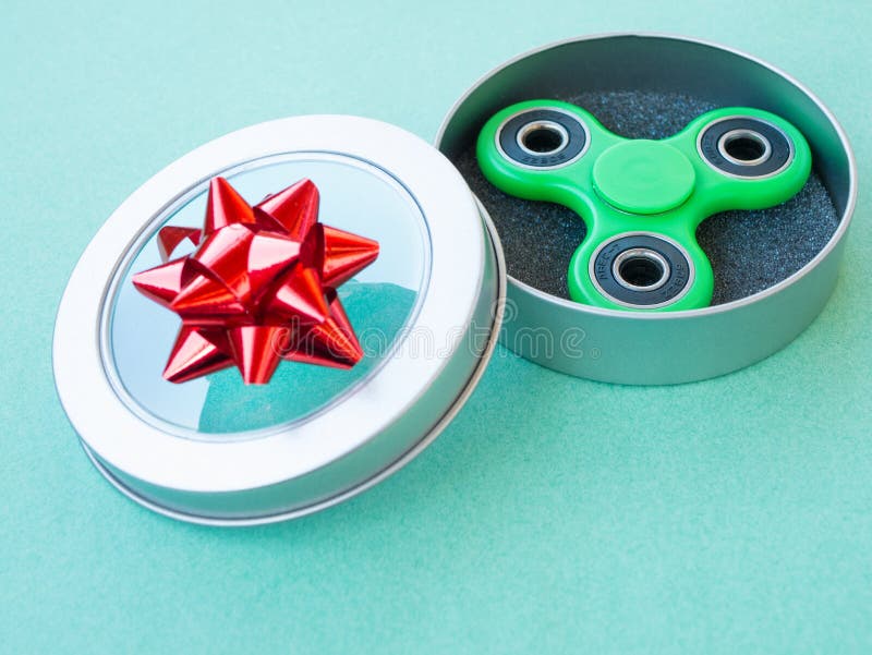 Popular Colourful Fidget Spinner Toy in a Gift Box on a Colored ...