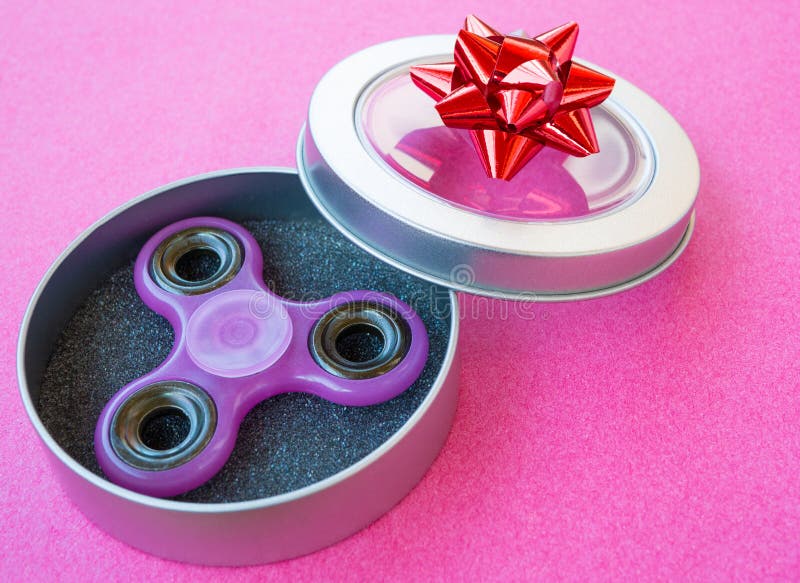 Popular Colourful Fidget Spinner Toy in a Gift Box on a Colored ...