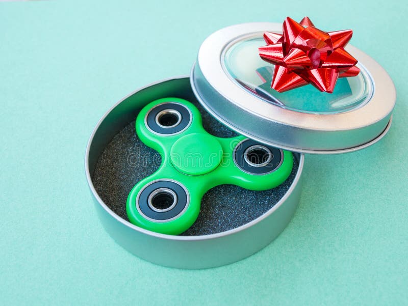 Popular Colourful Fidget Spinner Toy in a Gift Box on a Colored ...