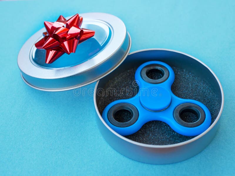 Popular Colourful Fidget Spinner Toy in a Gift Box on a Colored ...