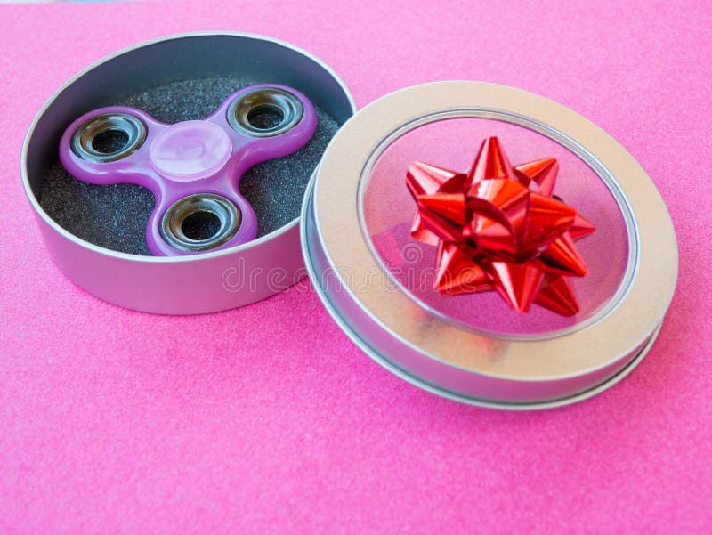 Popular Colourful Fidget Spinner Toy in a Gift Box on a Colored ...